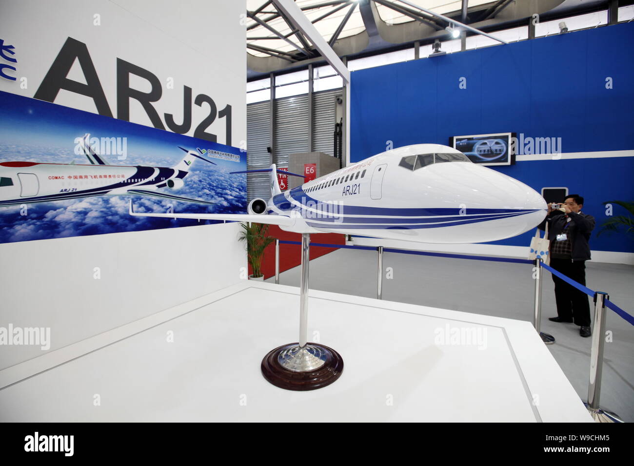 A model ARJ21 jet plane is seen on display at the stand of COMAC ...