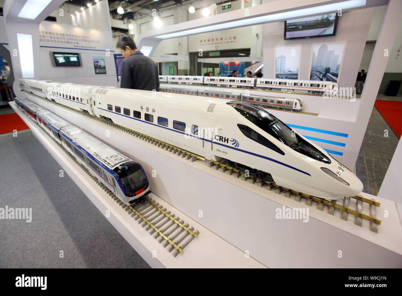 --FILE--A Chinese visitor looks at a model CRH (China Railway High ...