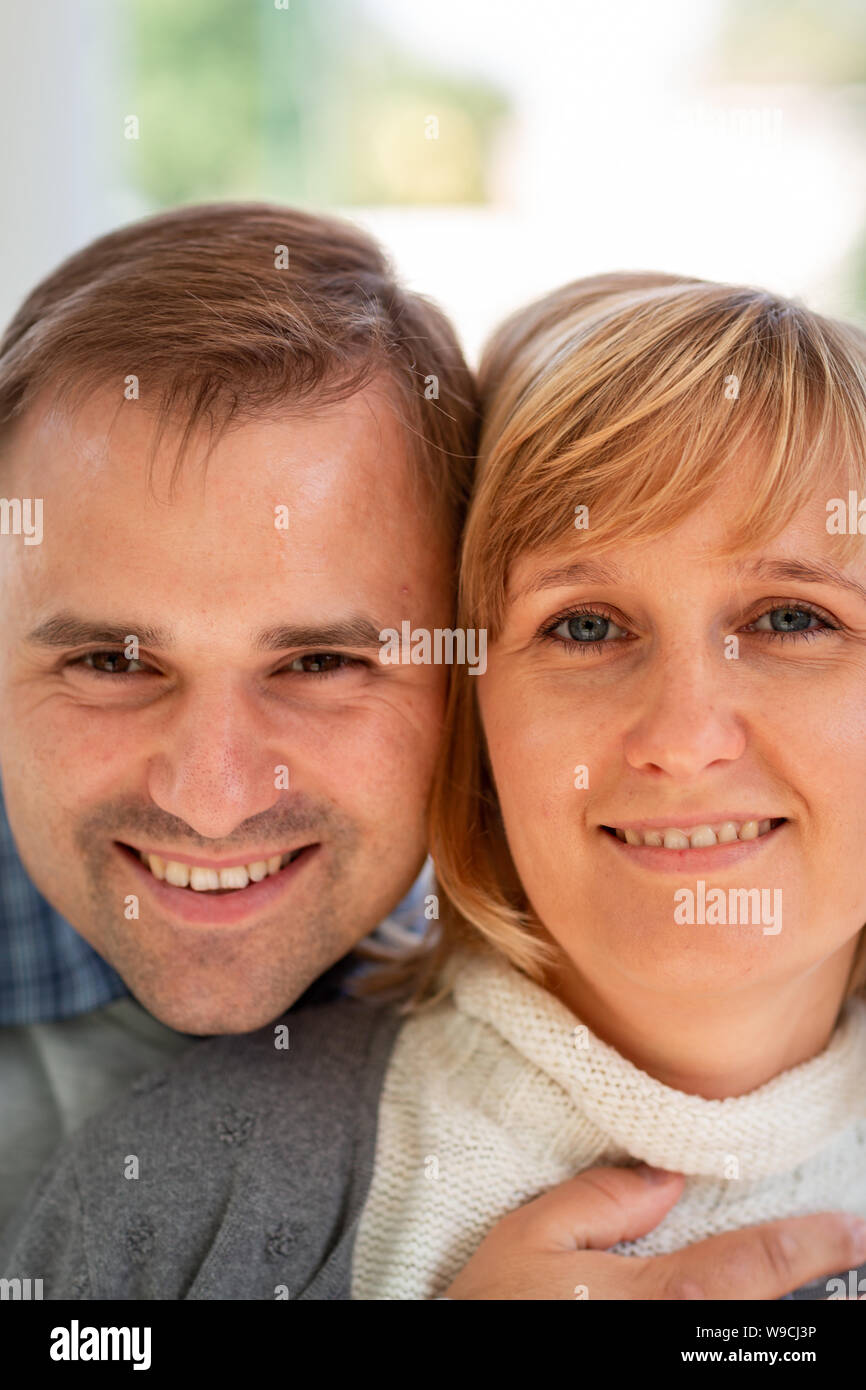 Happy young couple hugging and laughing together in the park outdoor ...