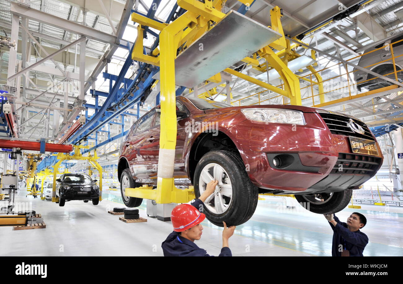 Chinese factory workers assemble Geely Gleagle SUVs at the Geely auto ...