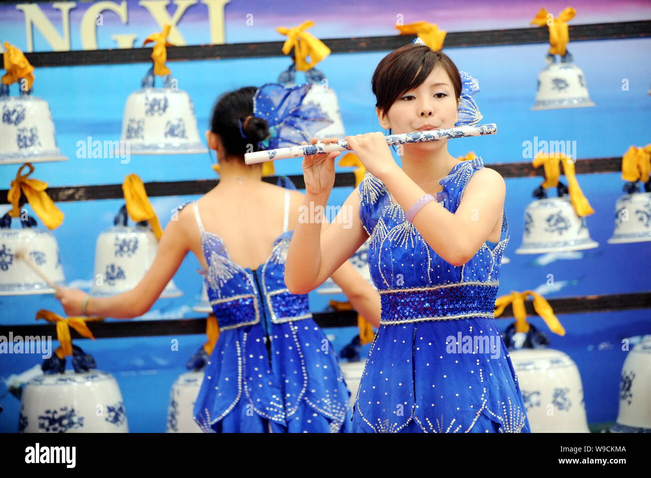 Chinese performers play porcelain musical instruments during a show to ...