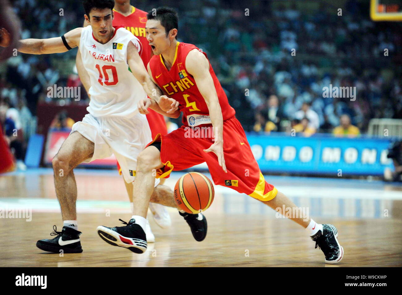 Chinas Liu Wei, right, tries to break through Hamed Afagh of Iran ...