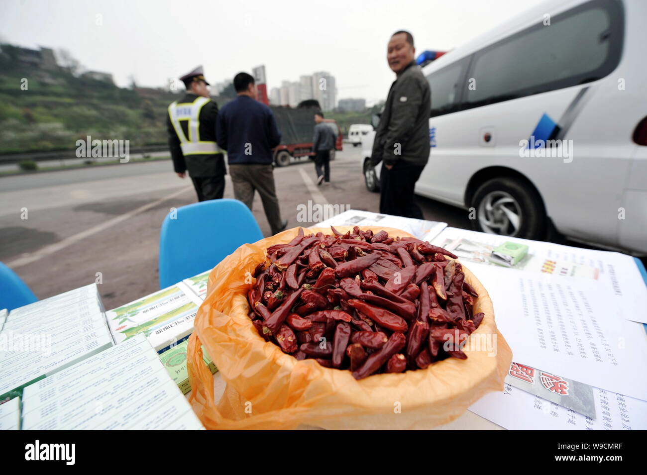 Chilies are seen prepared for drivers to eat at a service station of ...