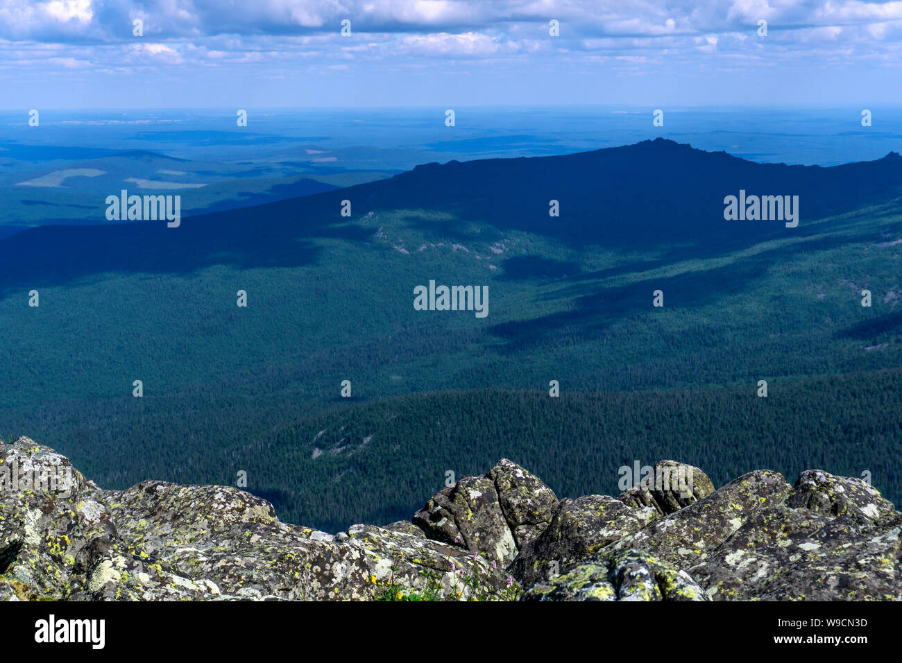 Mountain landscape with blue shadows from clouds on mountain slopes ...