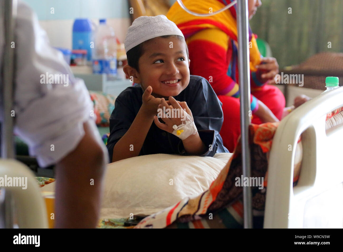 A kid with a Cannula at the hospital in Dhaka.A number of children ...