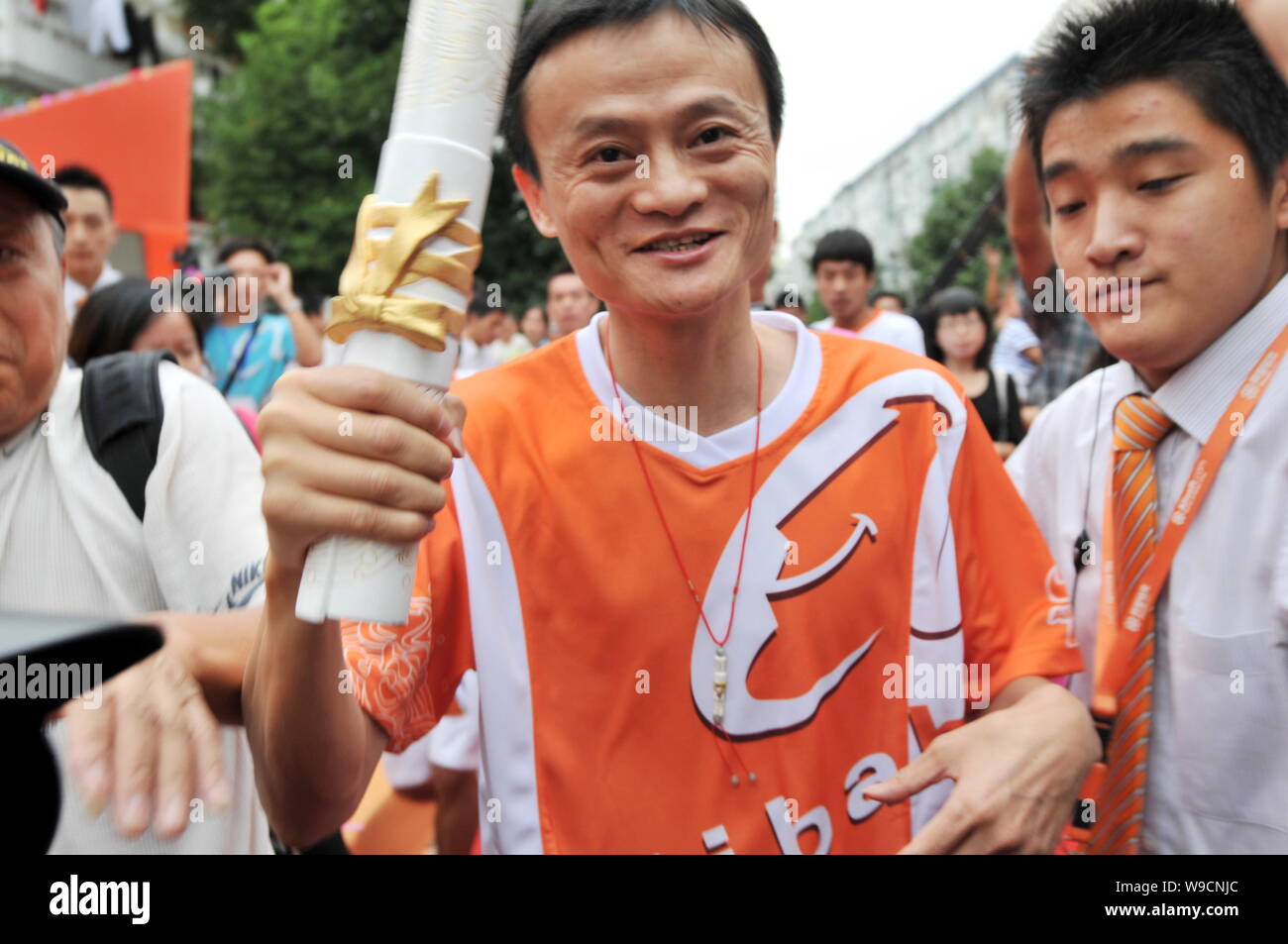Jack Ma (Ma Yun), center, Chairman of Alibaba Group, delivers the first ...