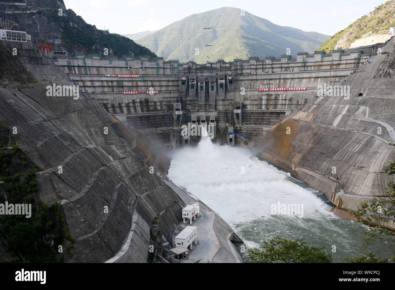 Water is seen discharged from the dam of the Xiaowan Hydropower Station ...