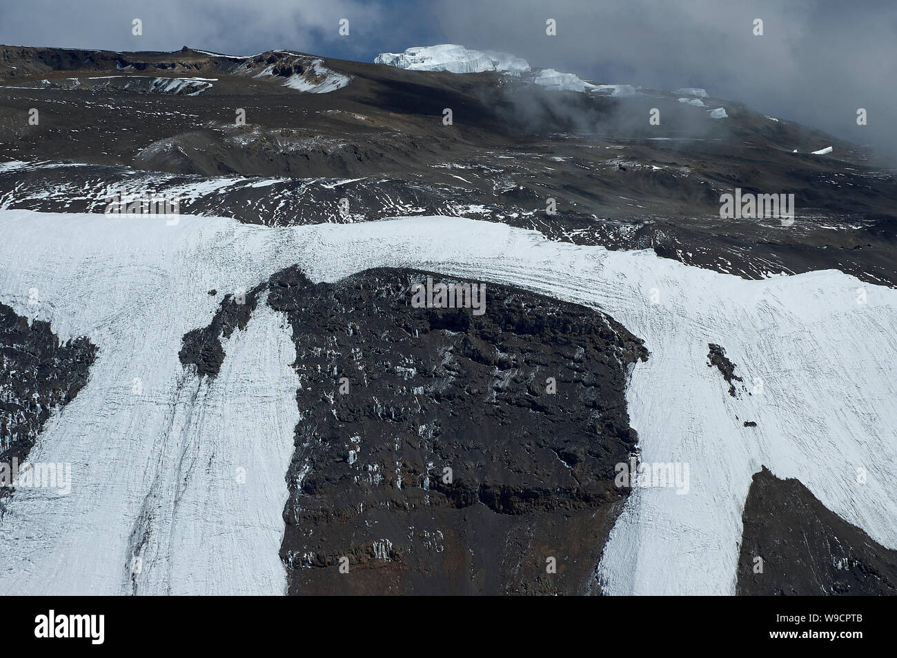 A climbing track above one of the last remaining glaciers on Mt ...