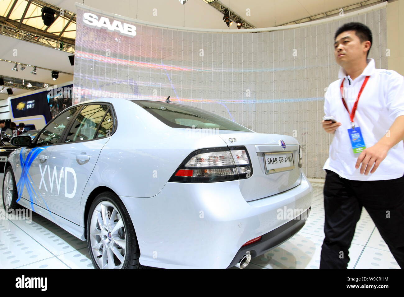 --FILE--A Chinese visitor walks past a Saab 93 XWD on display at the ...