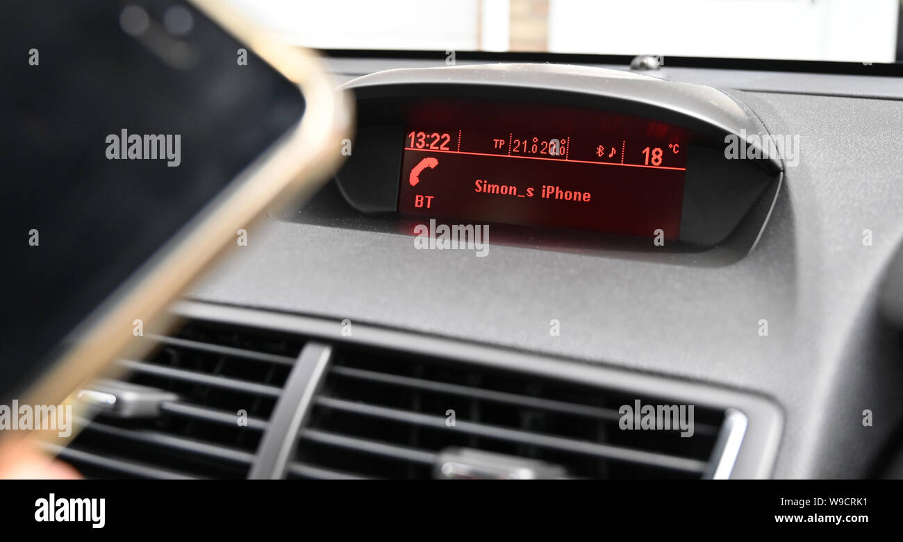Mobile smartphone connected to a car driving on board hands free system ...