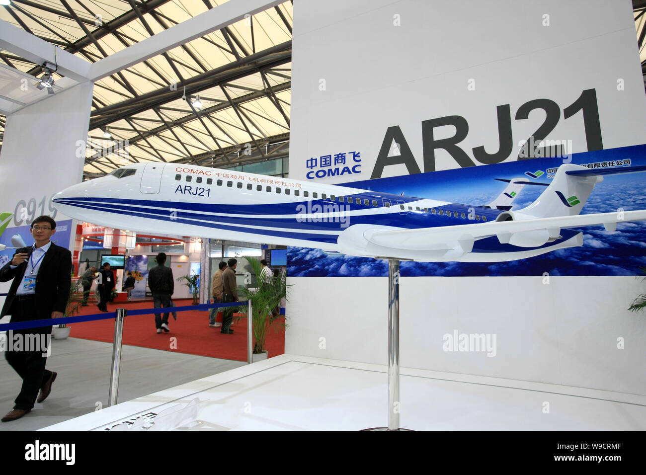 A model ARJ21 jet plane is seen on display at the stand of COMAC ...