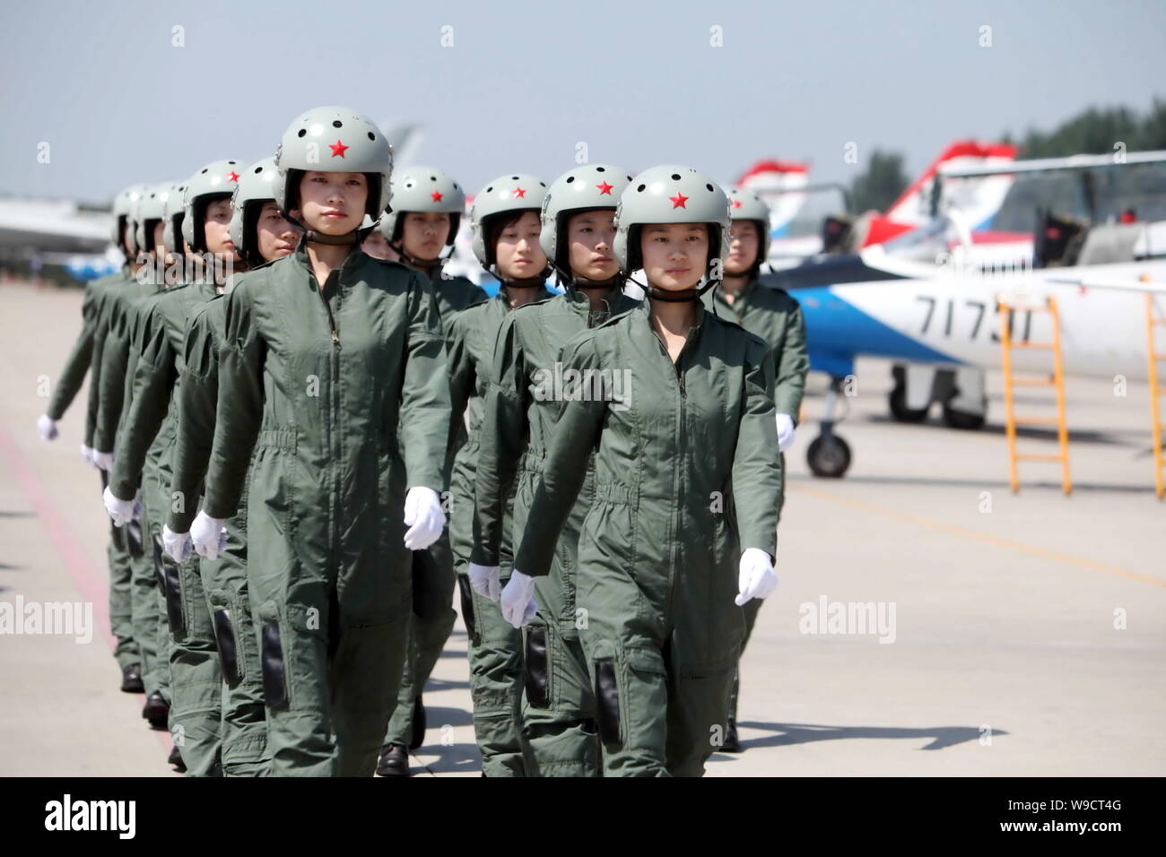 Young female fighter plane pilots of Chinese PLA Air Force walk past ...