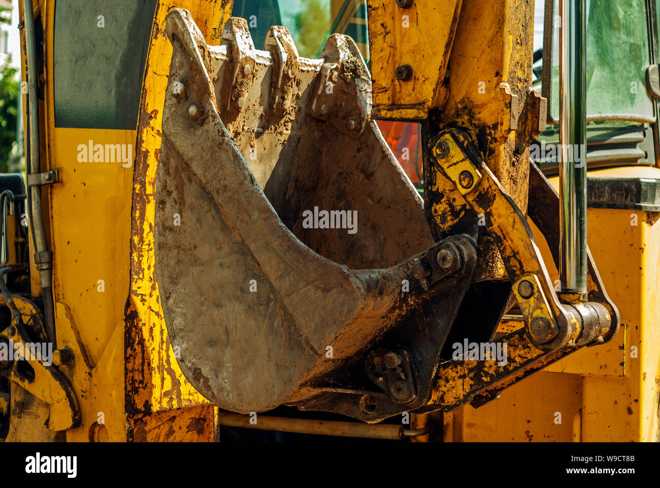bucket and manipulator of backhoe excavator closeup Stock Photo - Alamy