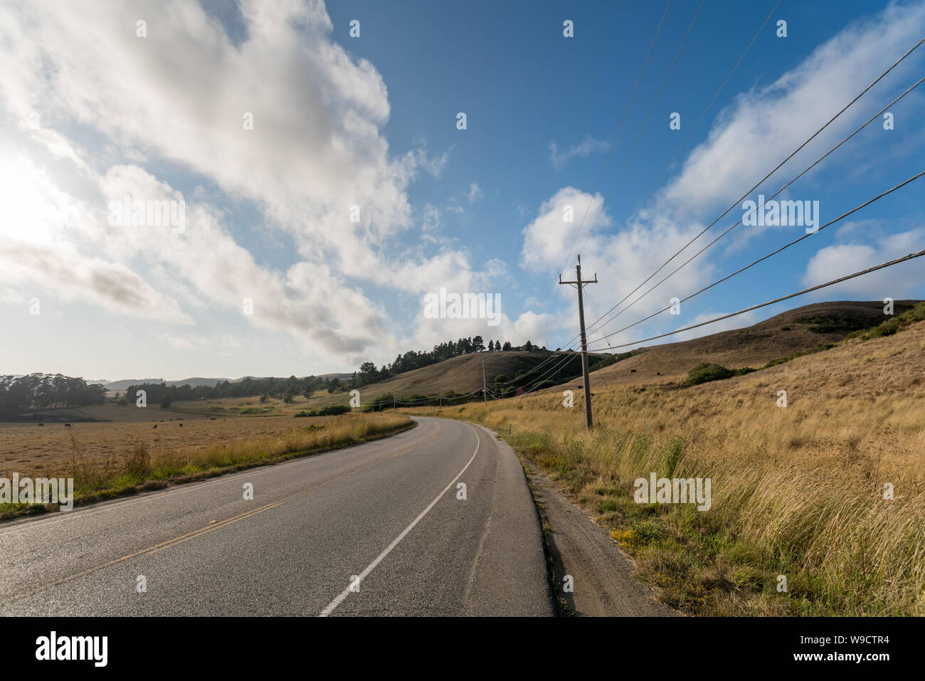 Country Side Road With Up coming Left Turn Stock Photo - Alamy
