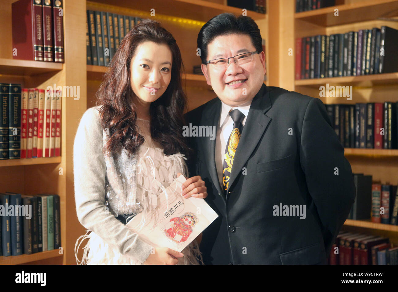 South Korean actress Kim Hee-Sun, left, poses with Chinese TV program ...