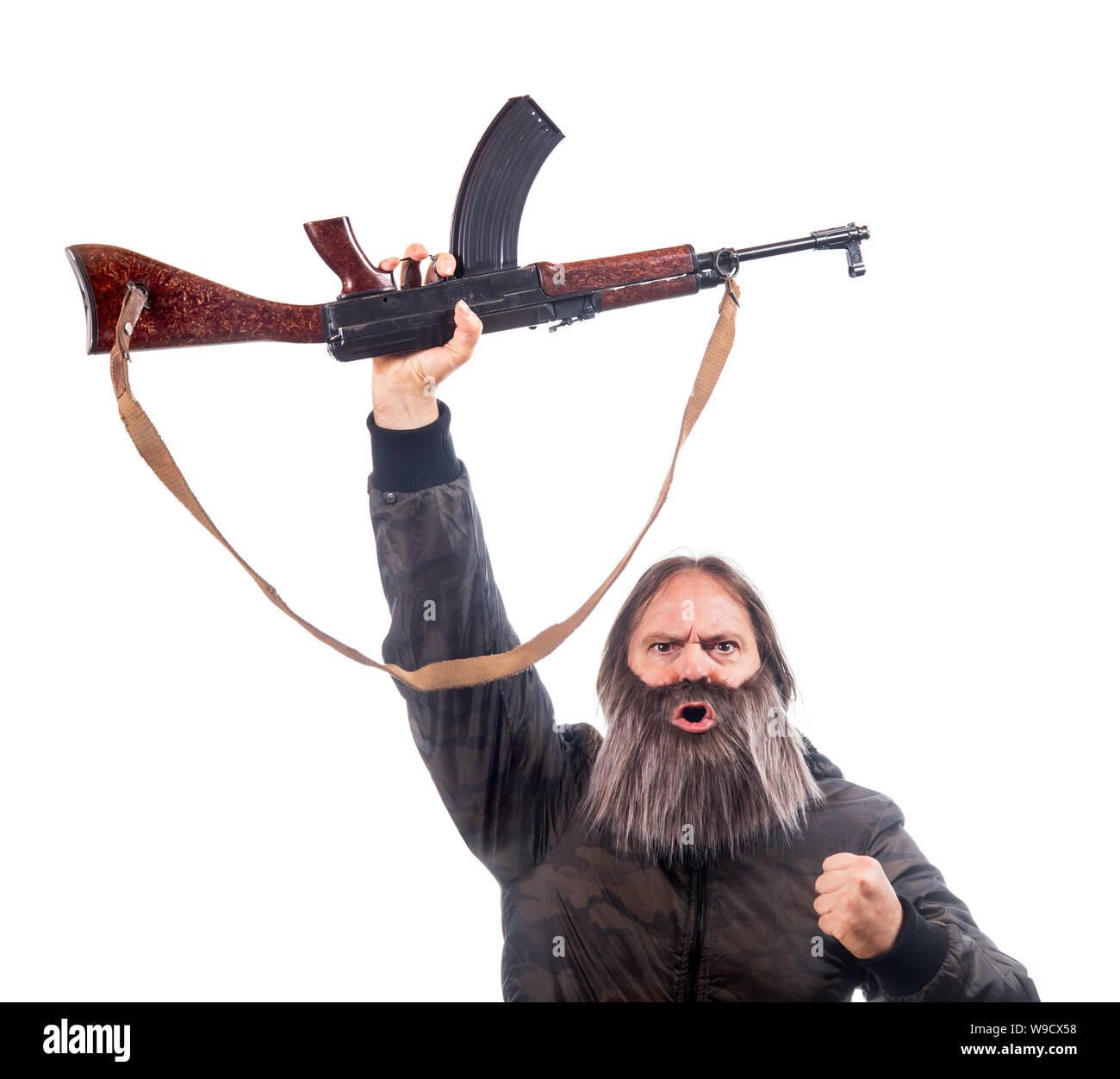 The bearded man rise kalashnikov isolated on a white background ...