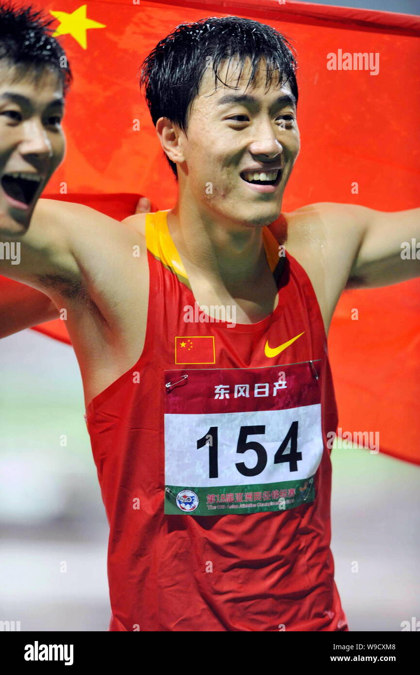 Chinese hurdler Liu Xiang, right, and his teammate Shi Dongpeng ...