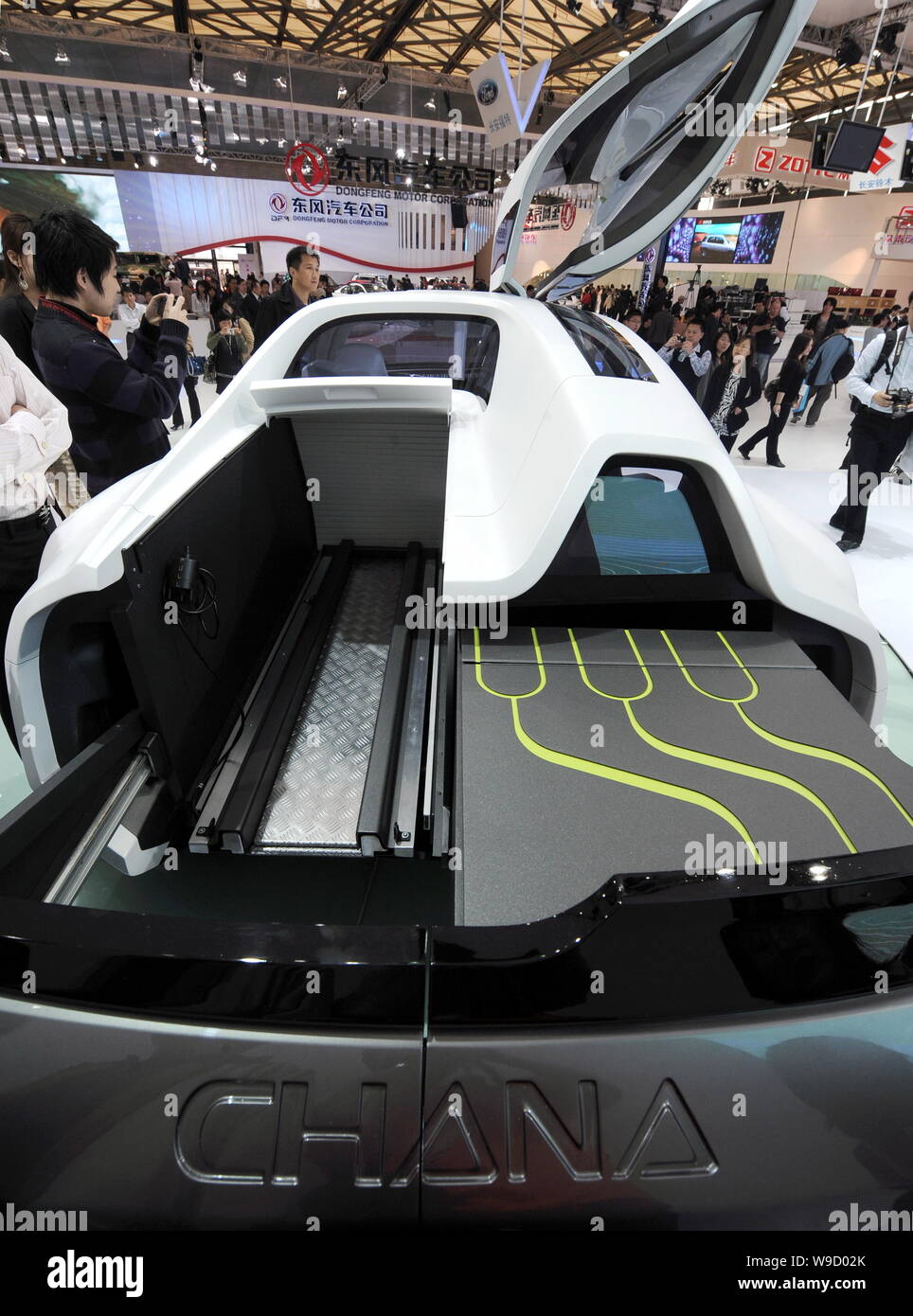 Visitors look at a Chana e301 Concept at the 13th Shanghai ...