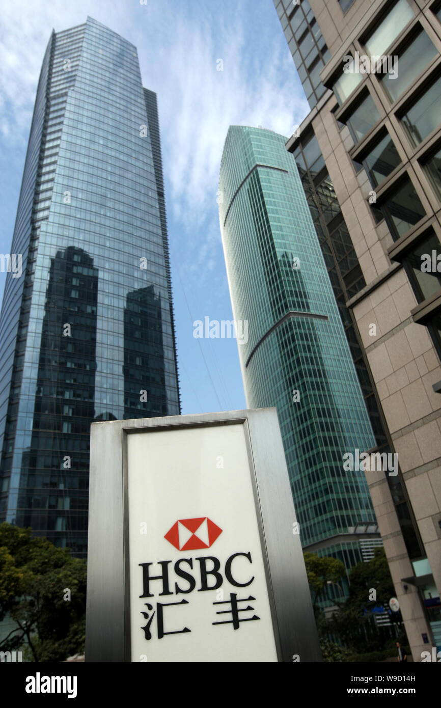 --FILE--A signboard of HSBC is seen amid skyscrapers in the Lujiazui ...
