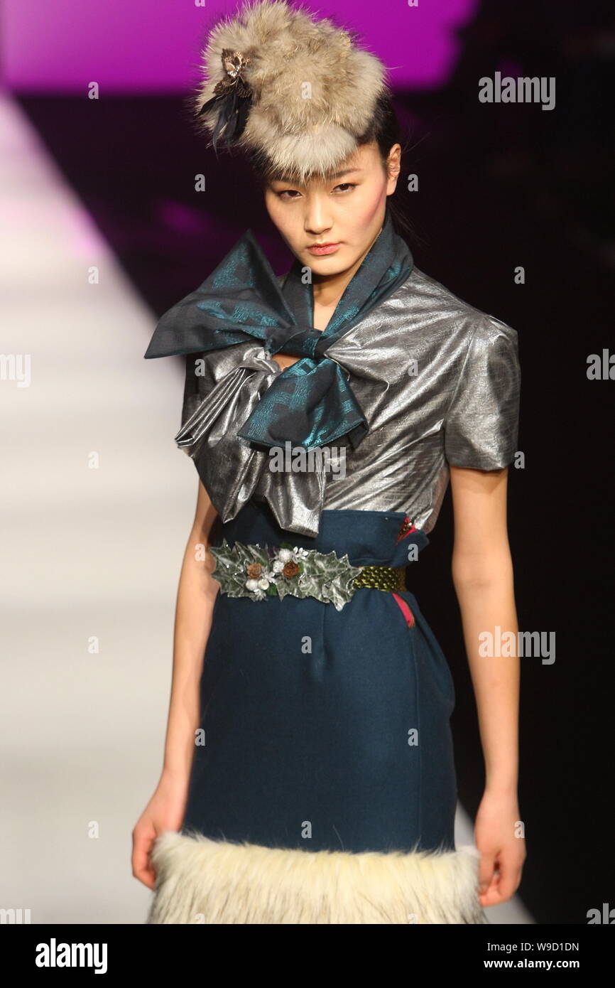 A model parades at a Wan Mengyi fashion show during the Shanghai ...