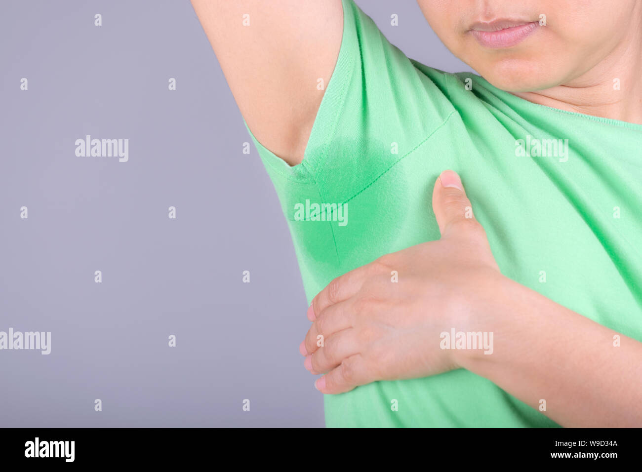 Close-up young women with hyperhidrosis sweating. Young woman with ...