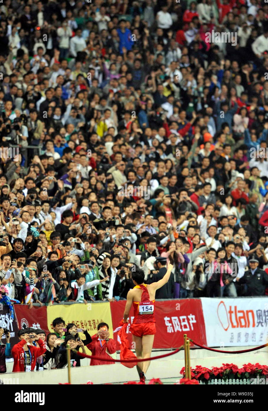 Chinese hurdler Liu Xiang greets spectators after he won the mens 110m ...