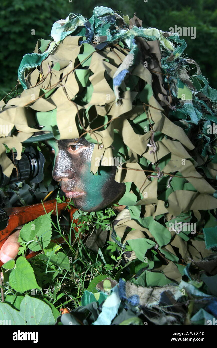A Chinese PLA (Peoples Liberation Army) sniper aims during a military ...