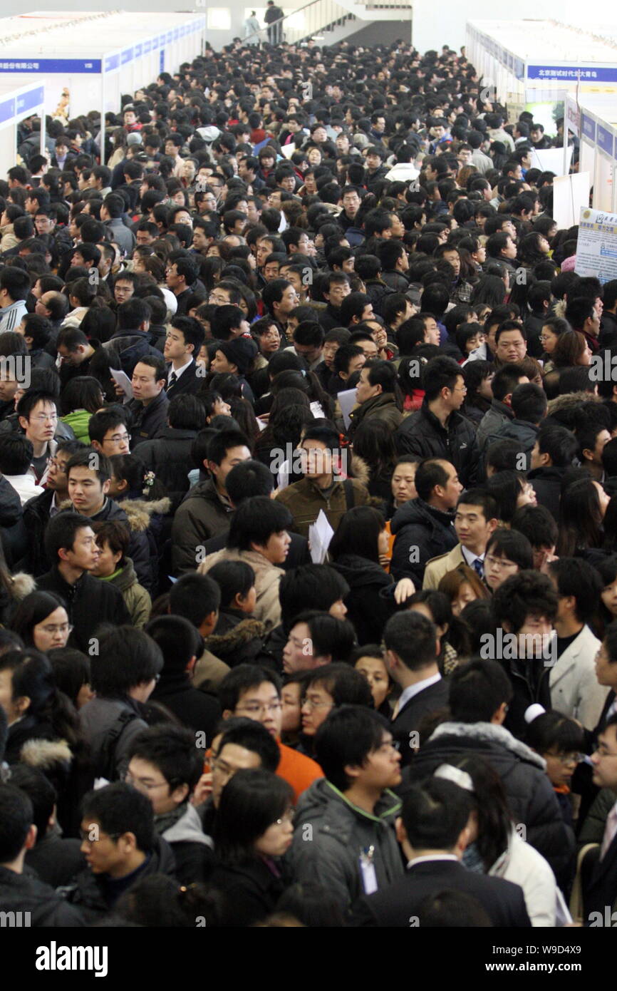Chinese job seekers crowd stalls at a job fair in Beijing, China ...