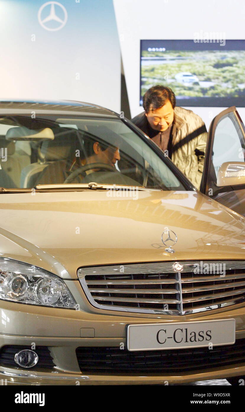 --FILE--Chinese visitors try a Mercedes-Benz C-Class car at an auto ...