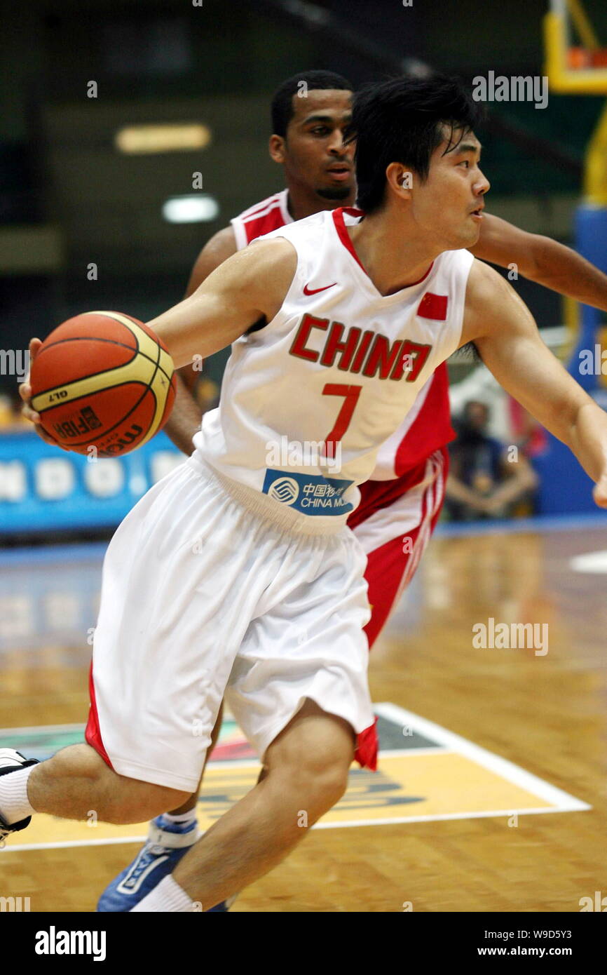 Chinas Wang Shipeng dribbles while competing against UAE (United Arab ...