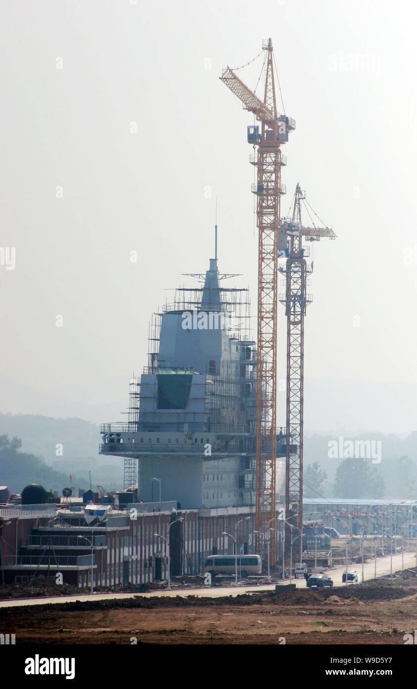 A building in the shape of an aircraft carrier is seen under ...