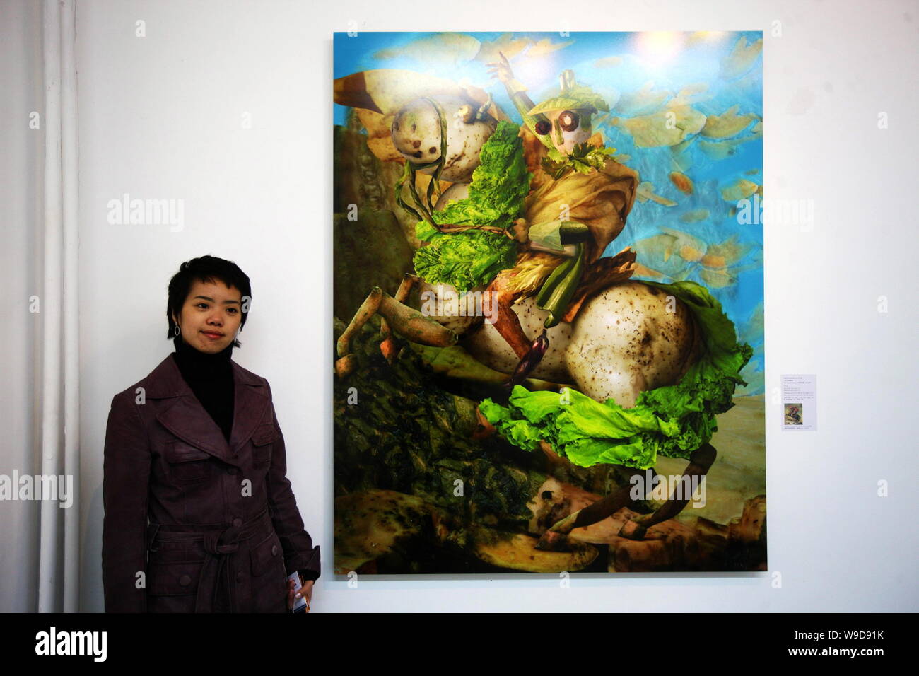 Chinese artist Ju Duoqi poses with her work Napoleon On Potatoes during ...