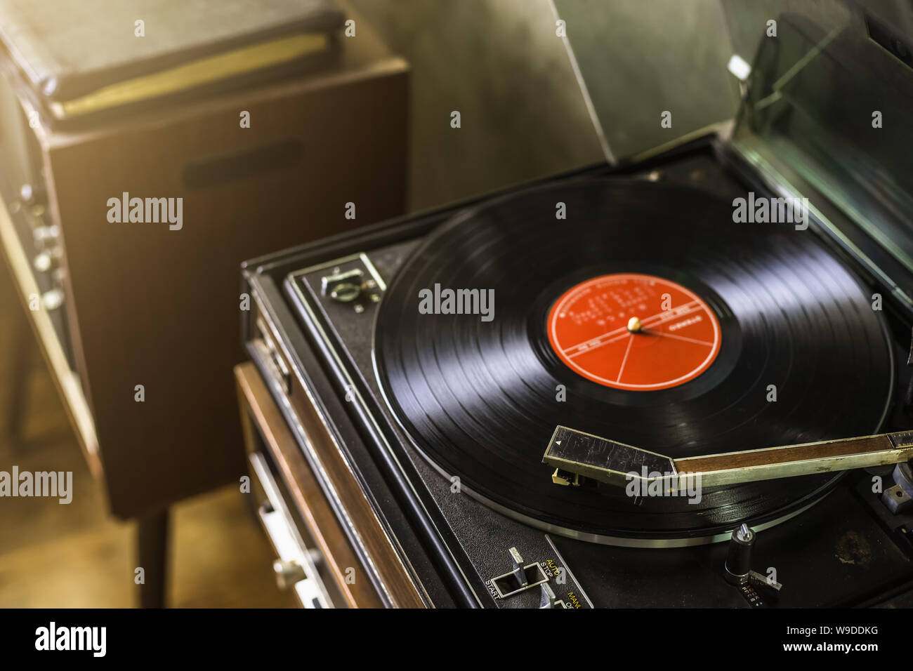 Vintage portable record player "Phonograph" with a vinyl record disk ...