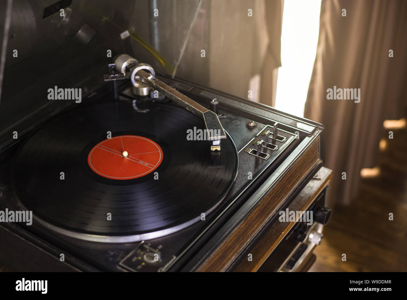 Vintage portable record player "Phonograph" with a vinyl record disk ...