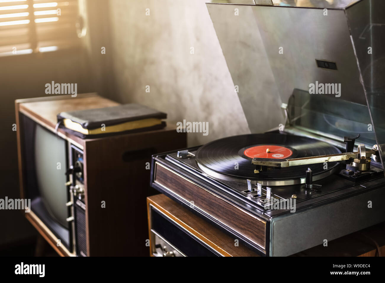 Vintage portable record player "Phonograph" with a vinyl record disk ...