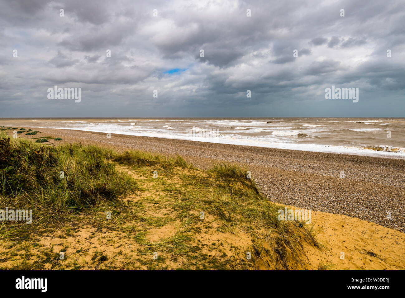 Sand dunes and crashing storm waves at Thorpeness Beach, Suffolk, UK ...