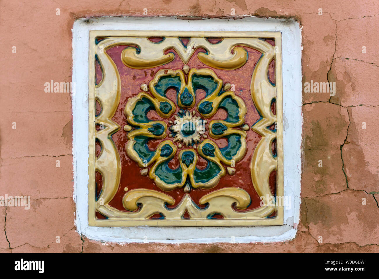 ancient ceramic patterned tile in the wall of russian building of the ...