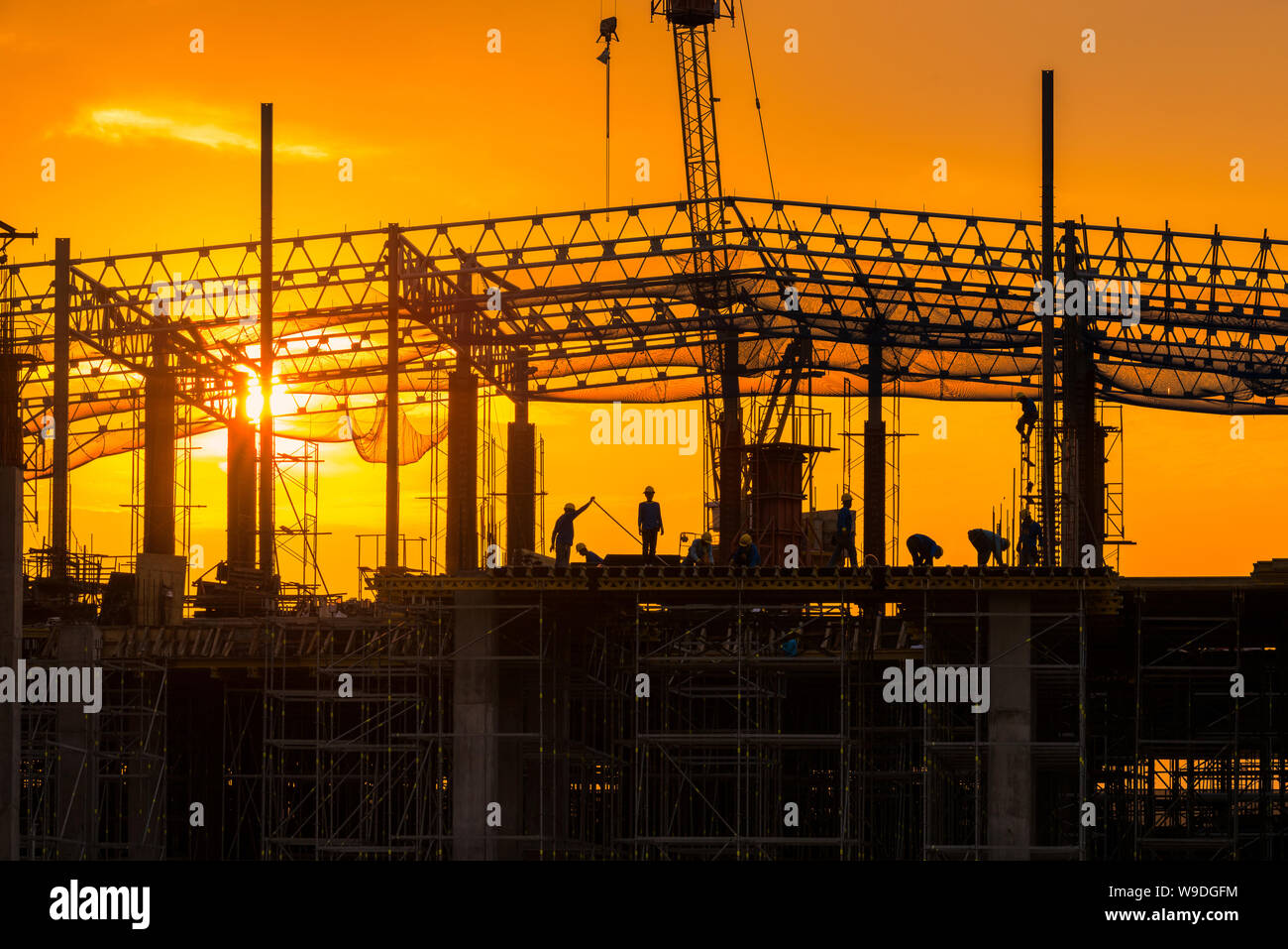 Workers busy operate at Construction site in beginning of building new ...