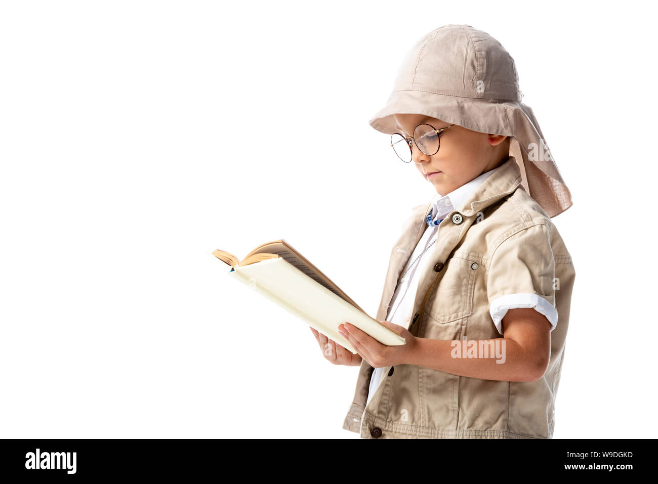 focused explorer child in glasses reading book isolated on white Stock ...