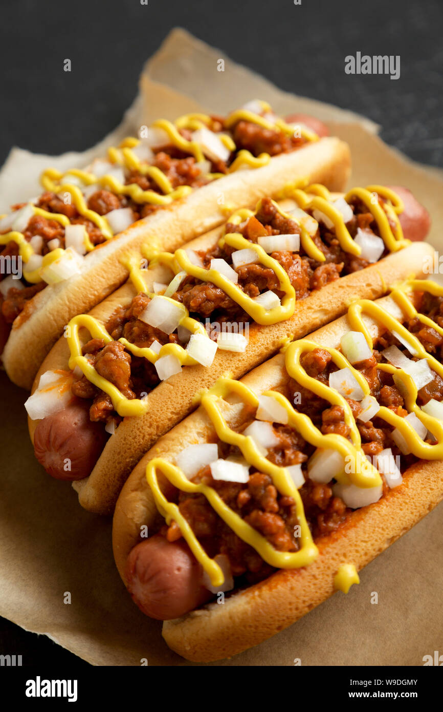 Homemade Detroit style chili dog on a black background, side view ...