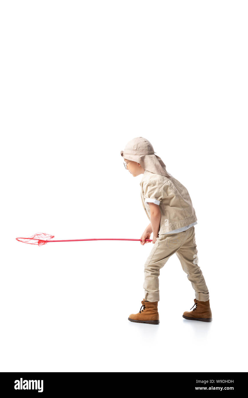 side view of explorer kid in hat holding butterfly net isolated on ...