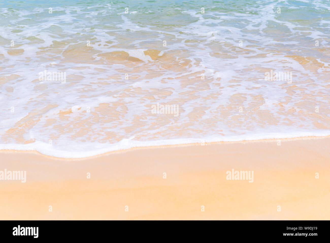 Close up beautiful sea wave on tropical sand beach in summer background ...