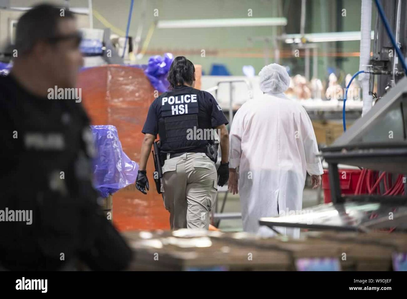 Customs officers detaining a person hi-res stock photography and images ...
