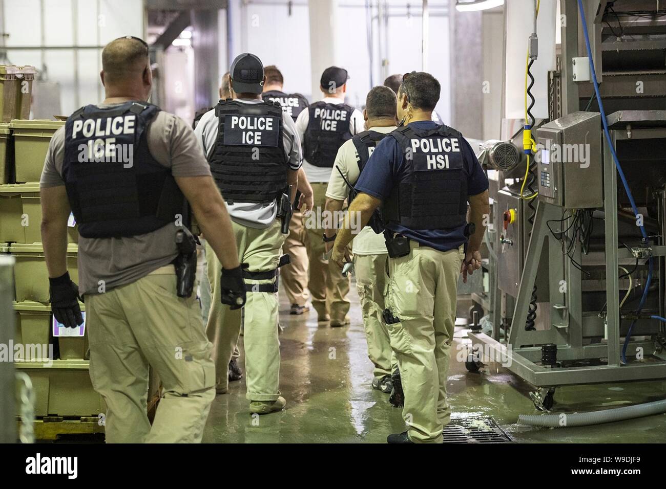 Customs officers detaining a person hi-res stock photography and images ...