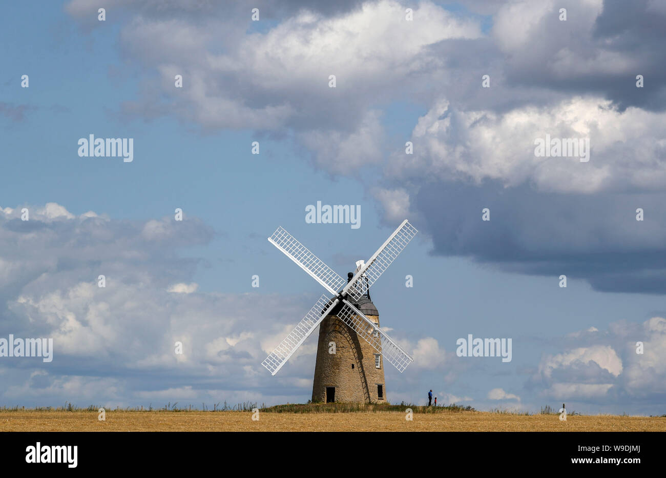 Walkers walk in front of Great Haseley windmill in Oxfordshire Stock ...