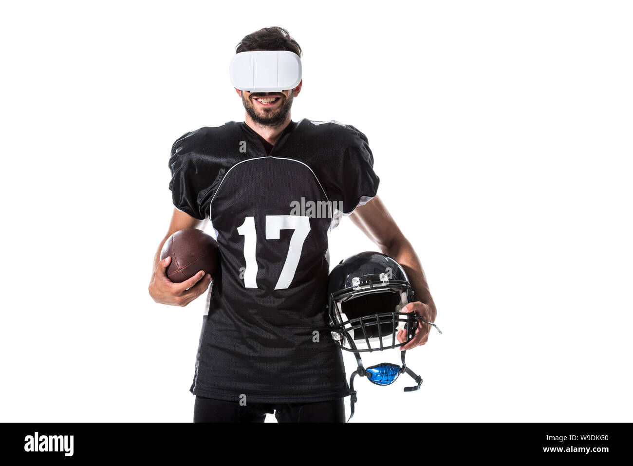 happy American Football player in virtual reality headset with ball ...