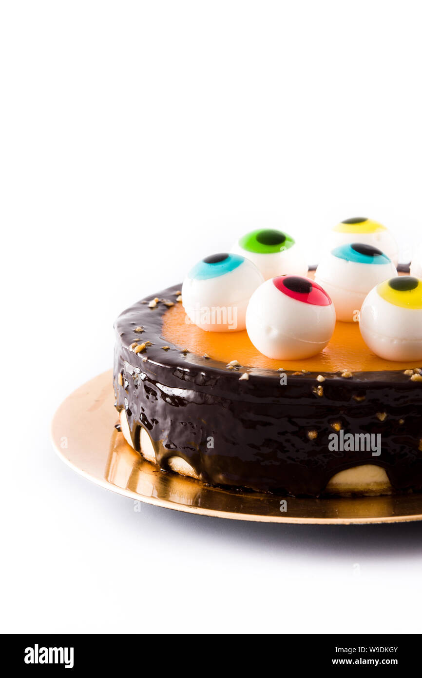Halloween cake with candy eyes decoration isolated on white background ...