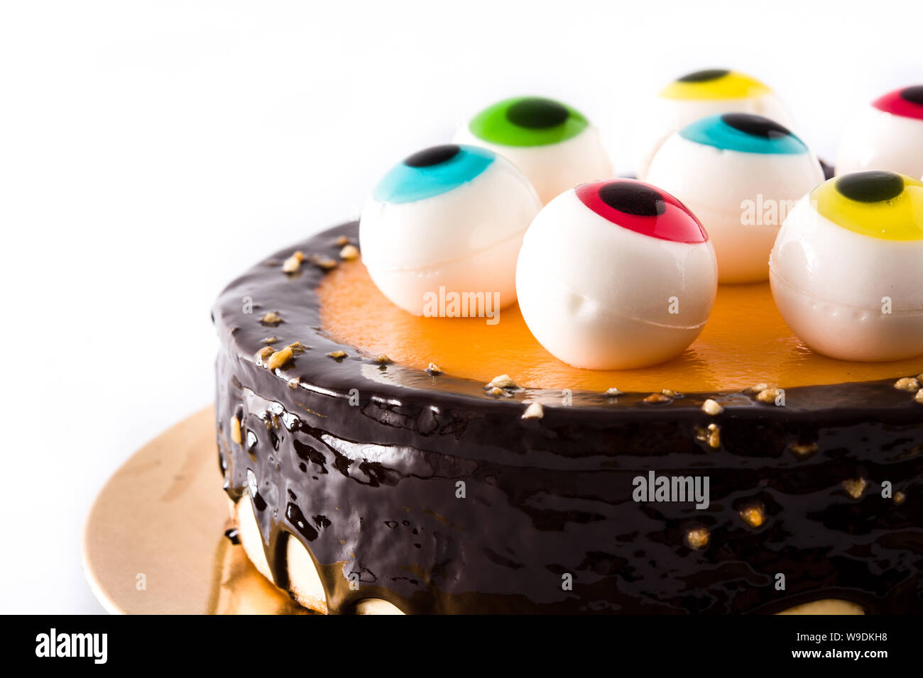 Halloween cake with candy eyes decoration isolated on white background ...