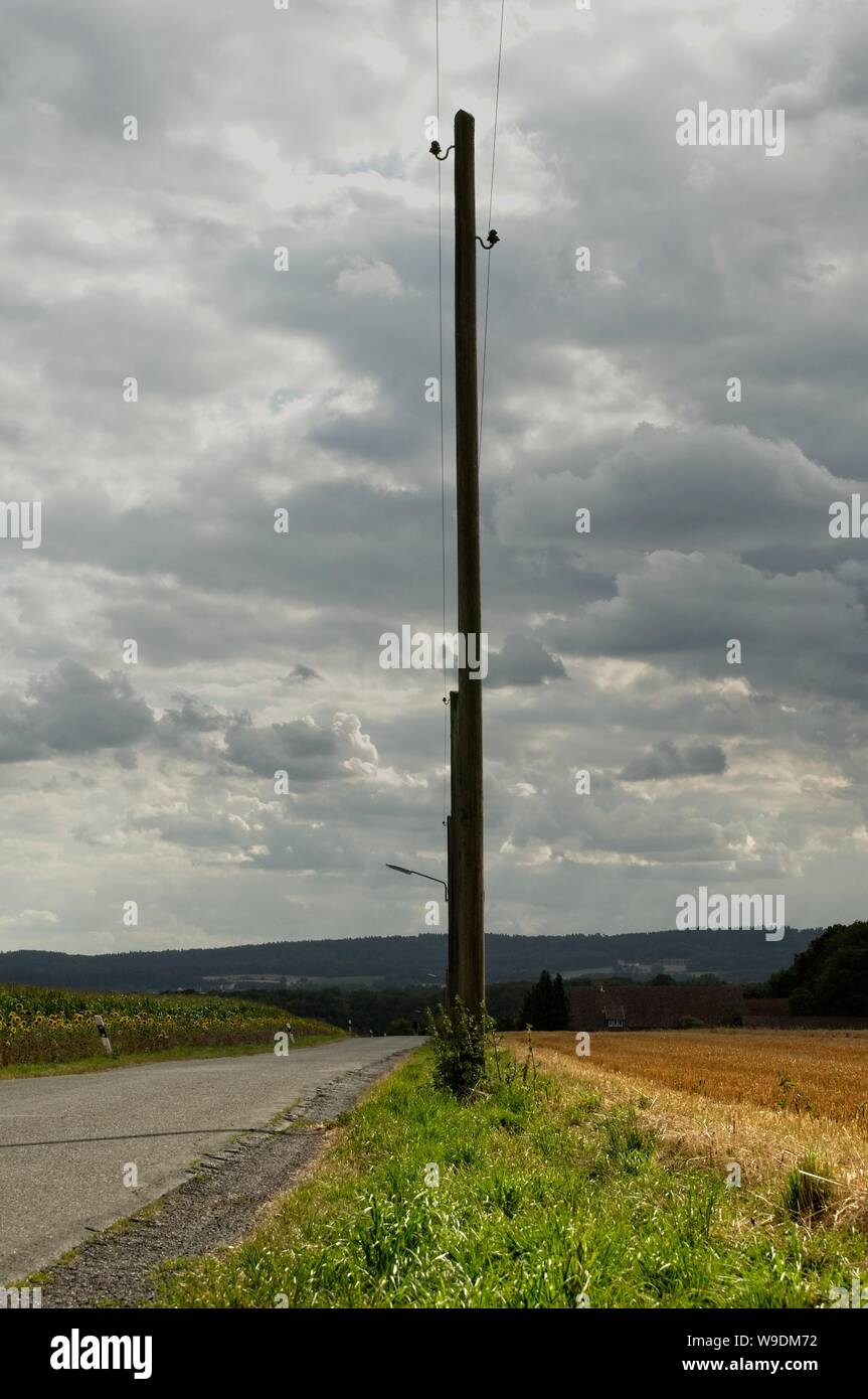 country road with telegraph posts Stock Photo - Alamy