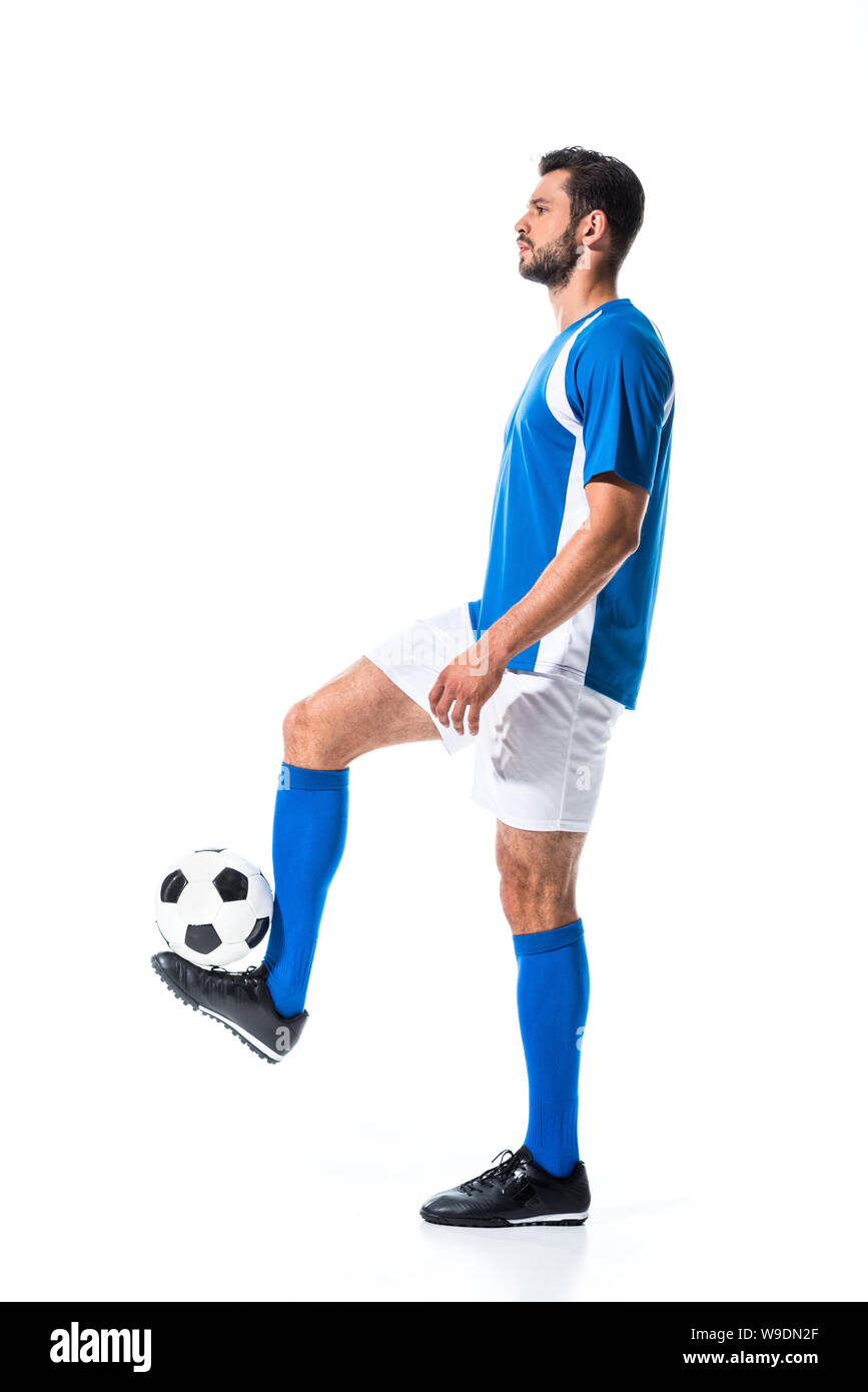 side view of soccer player training with ball Isolated On White Stock ...
